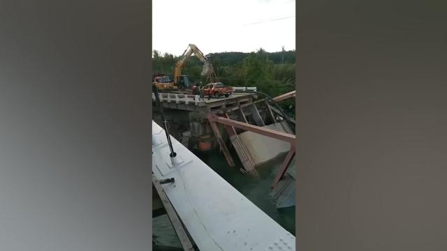 Mangled wreckage of bridge that collapsed in the Philippines killing ...