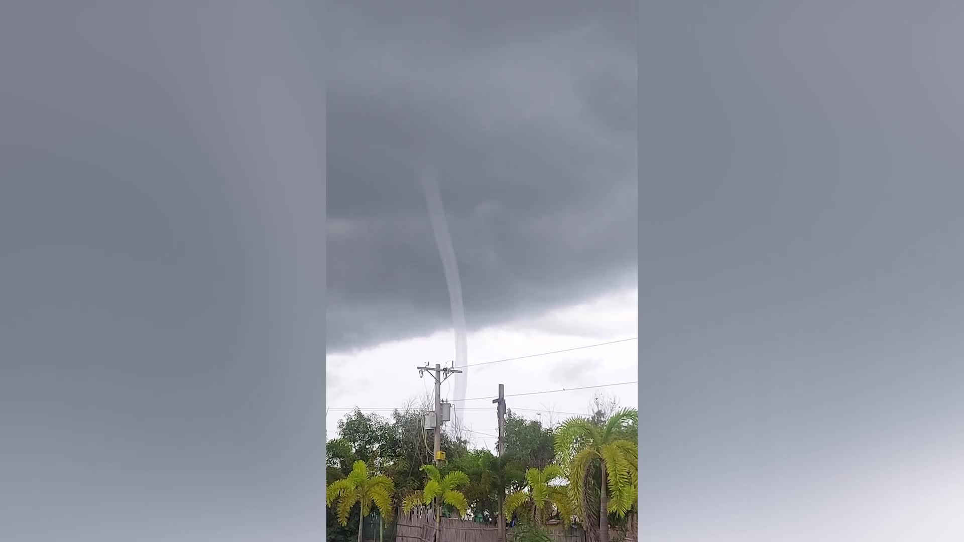 Long thin waterspout forms off Philippines coast spawning heavy rain ...