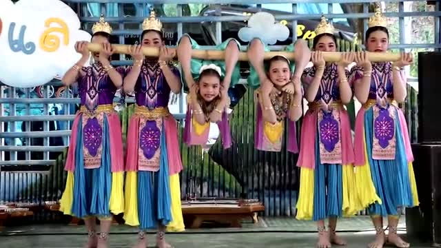 Dancers twist into incredible positions for traditional Thai ...