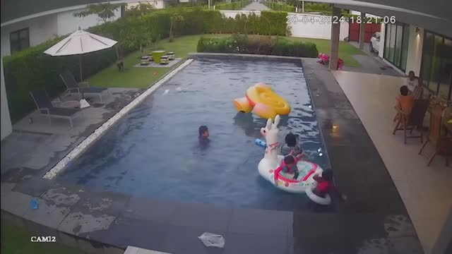 Drowning boy, 5, saved after falling from inflatable toy in swimming ...