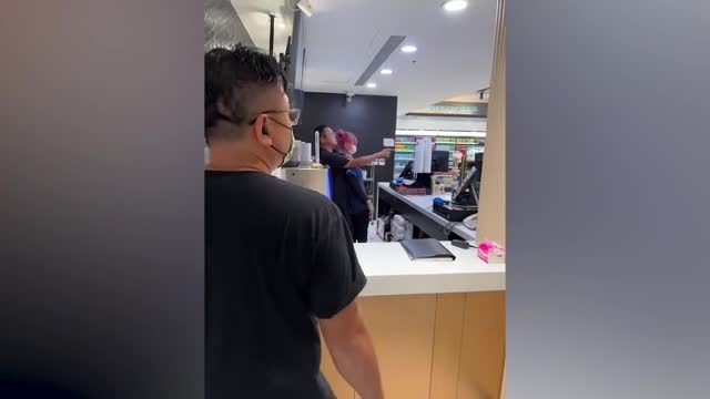 Frantic tourist takes store clerk as hostage when police arrive ...