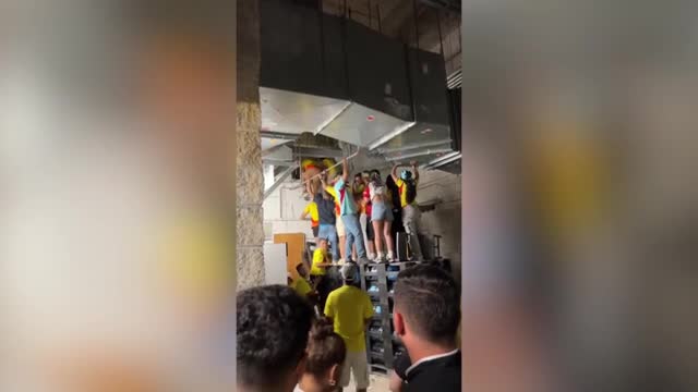 Football fans climb through air vents to see Copa America final ...
