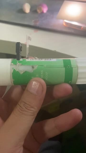 Check out this DIY microscope made from old phone and glue stick ...